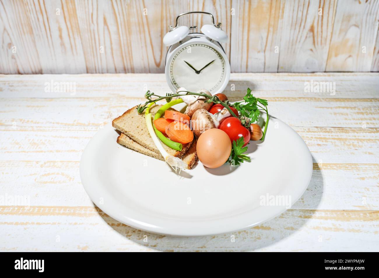 Interval fasting diet concept symbolized by a plate filled to one third ...