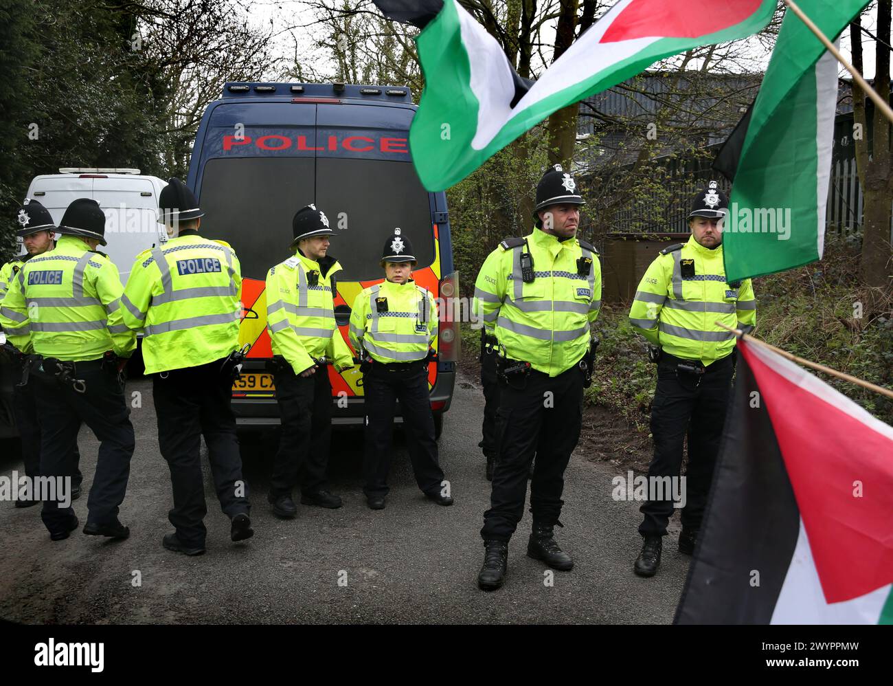 Police form a cordon as specialist officers cut the activists out of ...