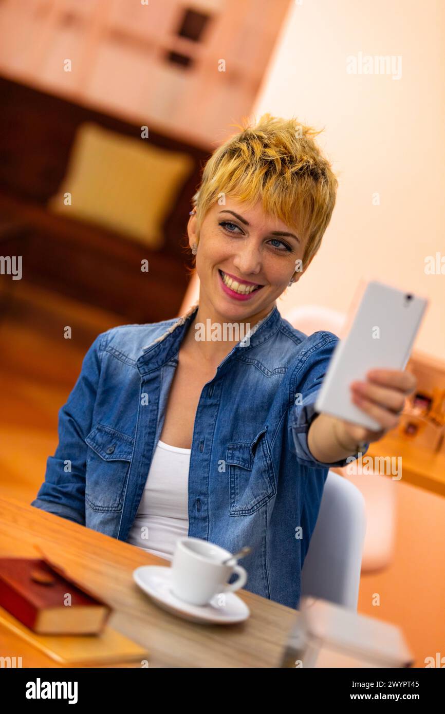 She finds joy in a simple café moment, her smile infectious as she ...
