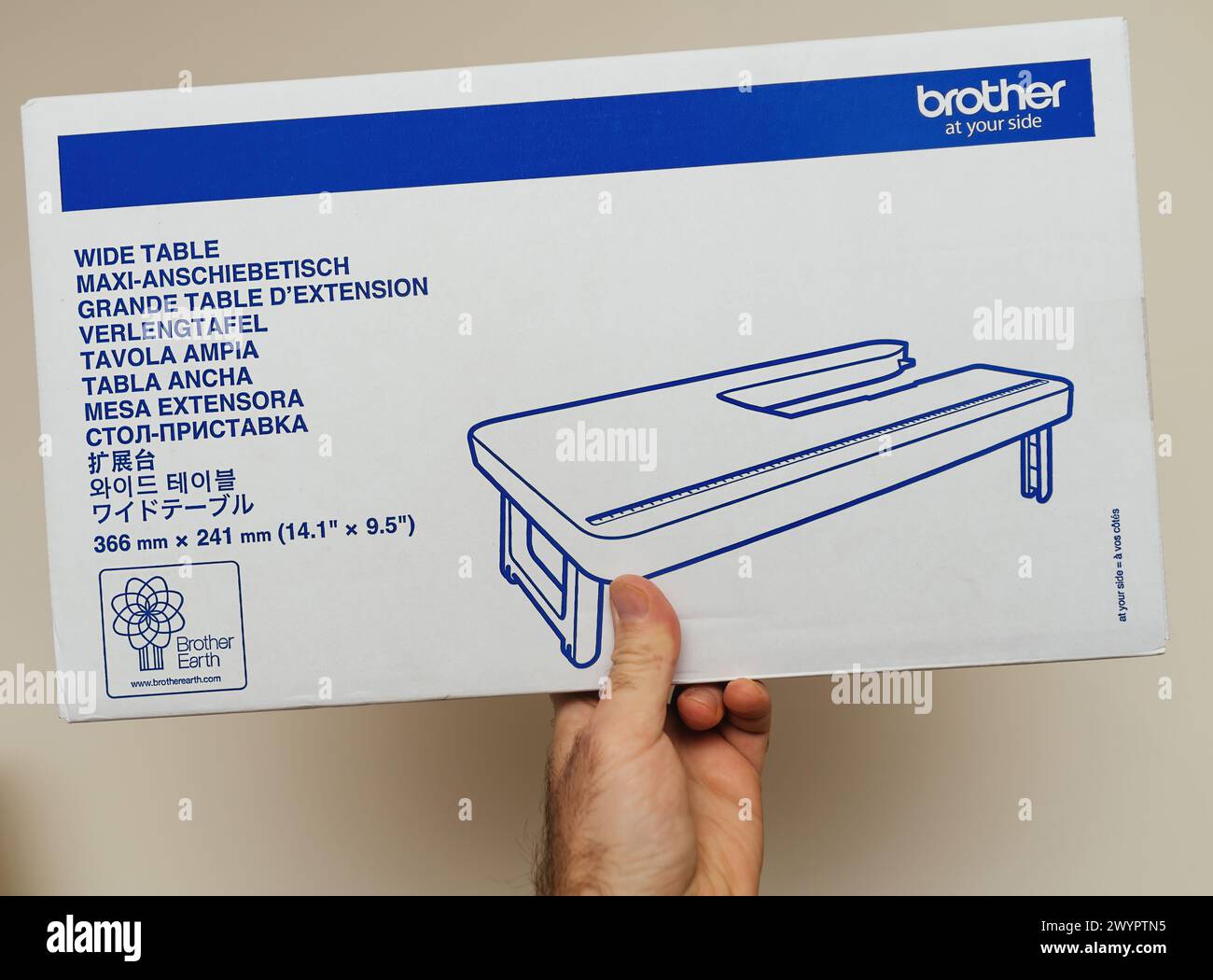 Paris, France - Mar 9, 2024: Hand holding a box of Brother brand wide ...