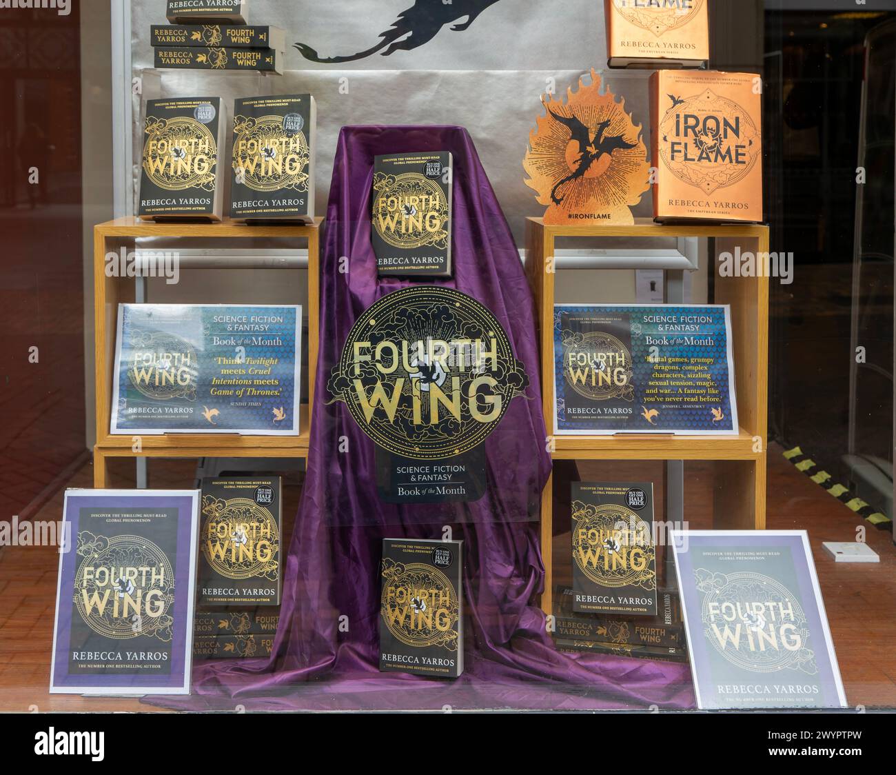 Book display 'Fourth Wing' by Rebecca Yarros in shop window of ...