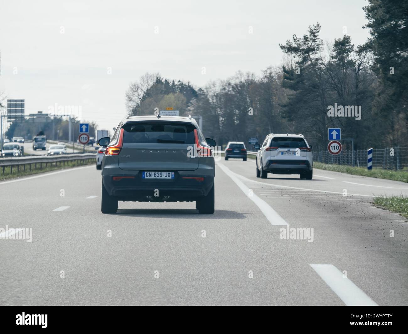 France - Mar 20, 2024:A rear view captures a Volvo SUV cruising along a ...
