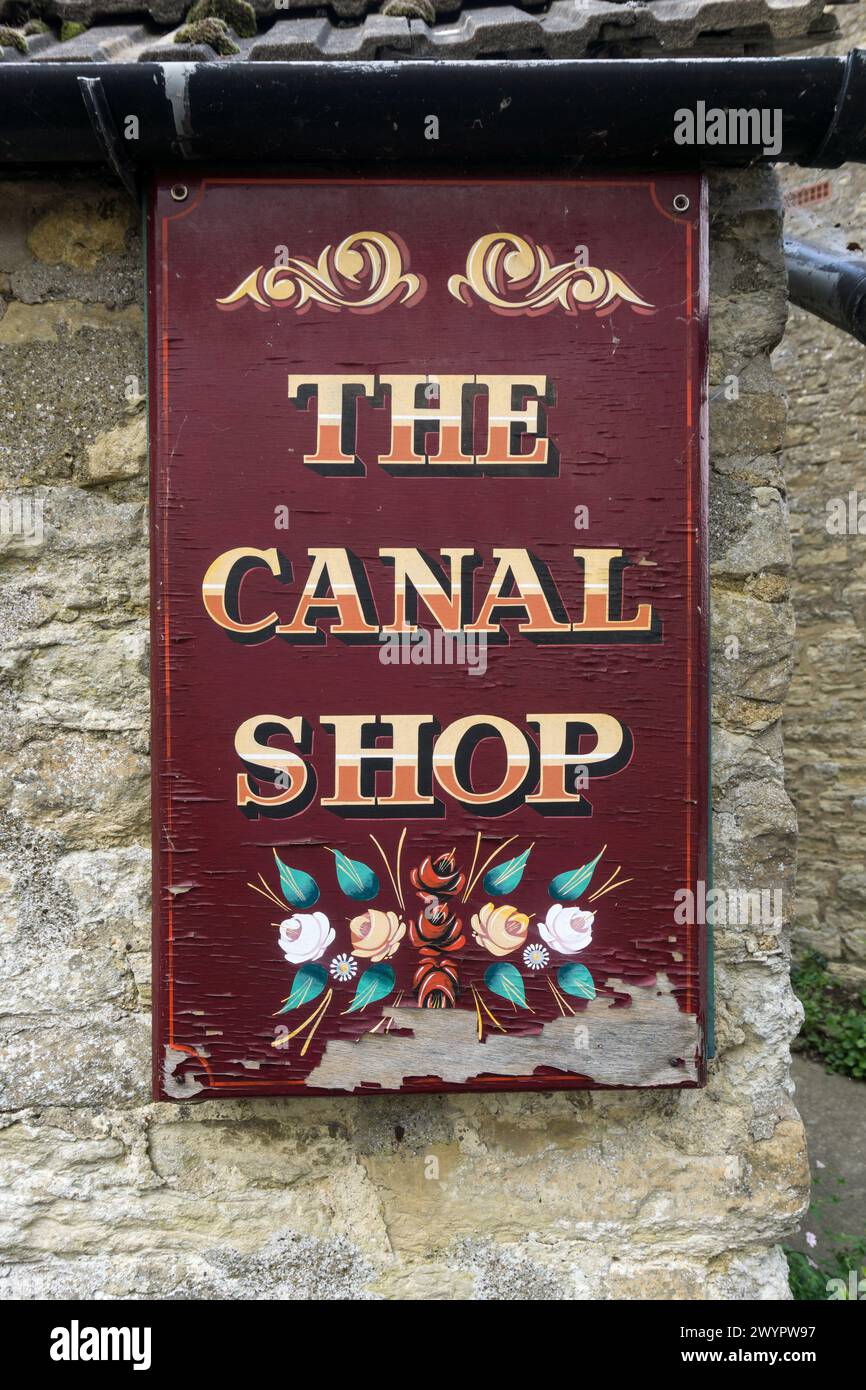 Signage with artwork for the Canal Shop on the Grand Union canal at ...