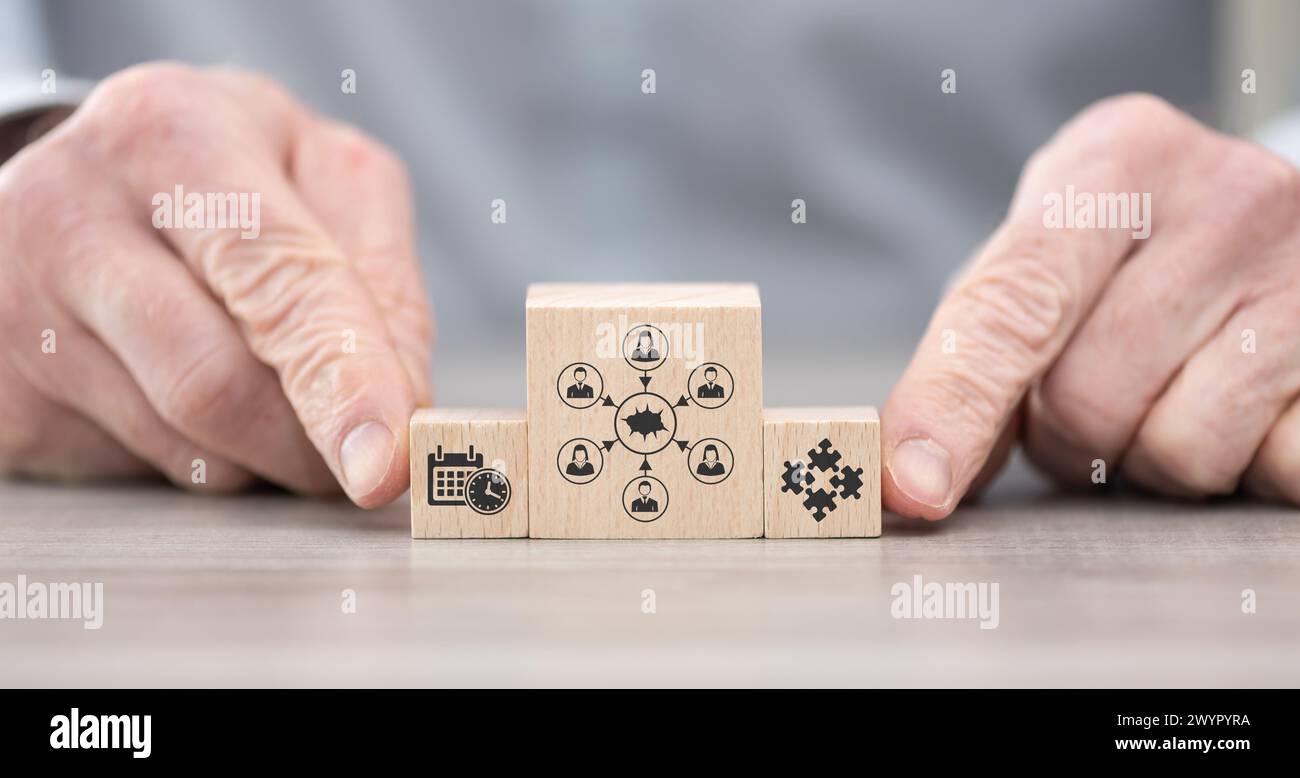 Wooden blocks with symbol of meeting concept Stock Photo - Alamy