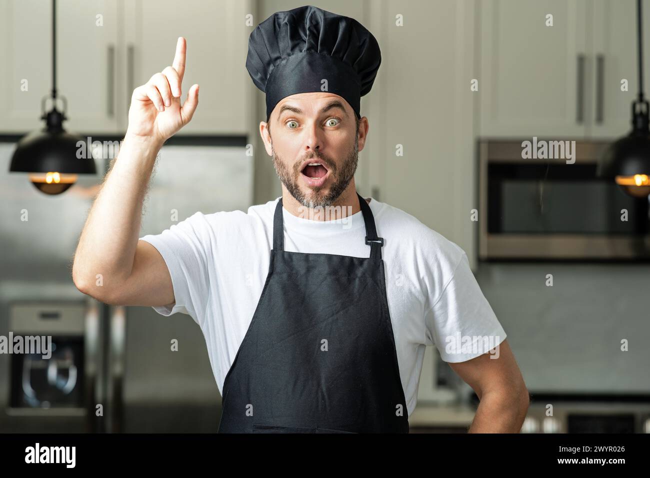 Idea for food. Professional chef man in uniform on kitchen. Bearded ...