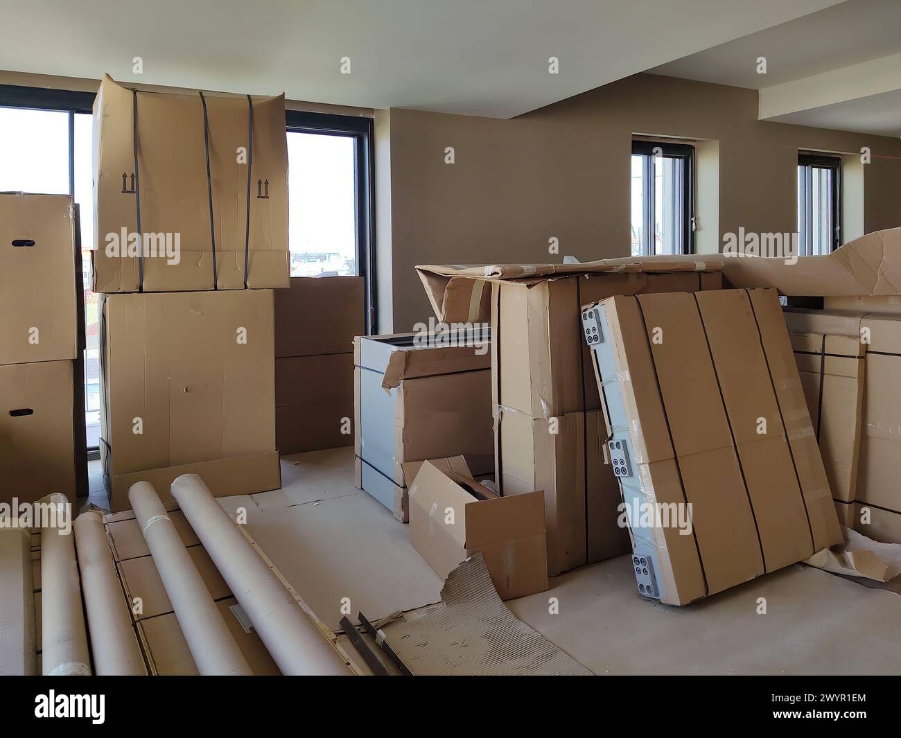 Boxes of furniture waiting to be assembled in a new apartment on ...
