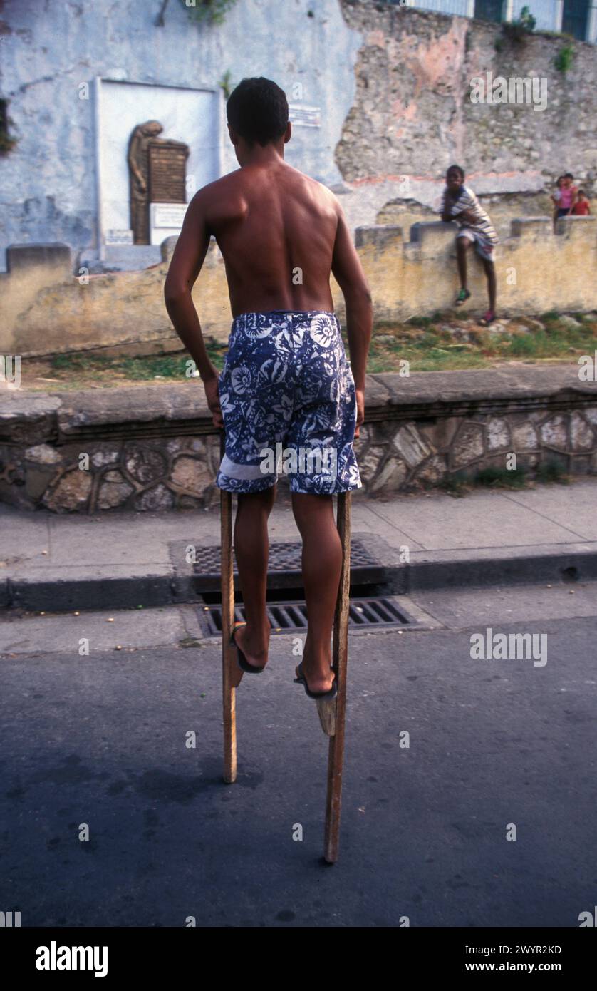 Boy on stilts hi-res stock photography and images - Alamy