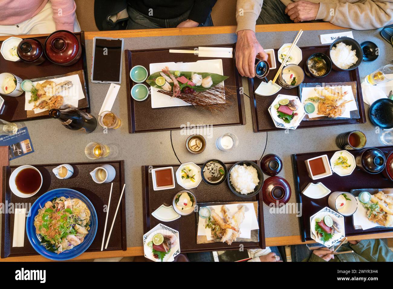 Overhead view looking down on trays of Japanese food Stock Photo - Alamy