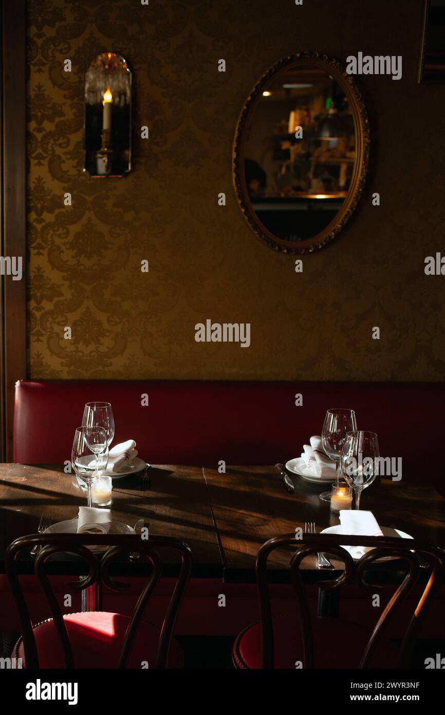 Dramatically lit dining room interior vertical Stock Photo - Alamy