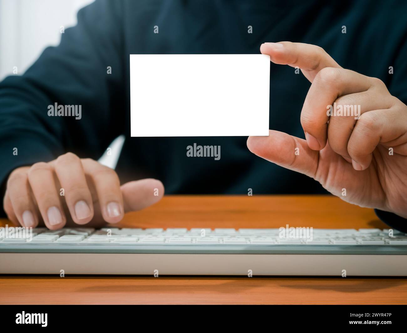 Businessman showing blank white plain namecard while working with ...