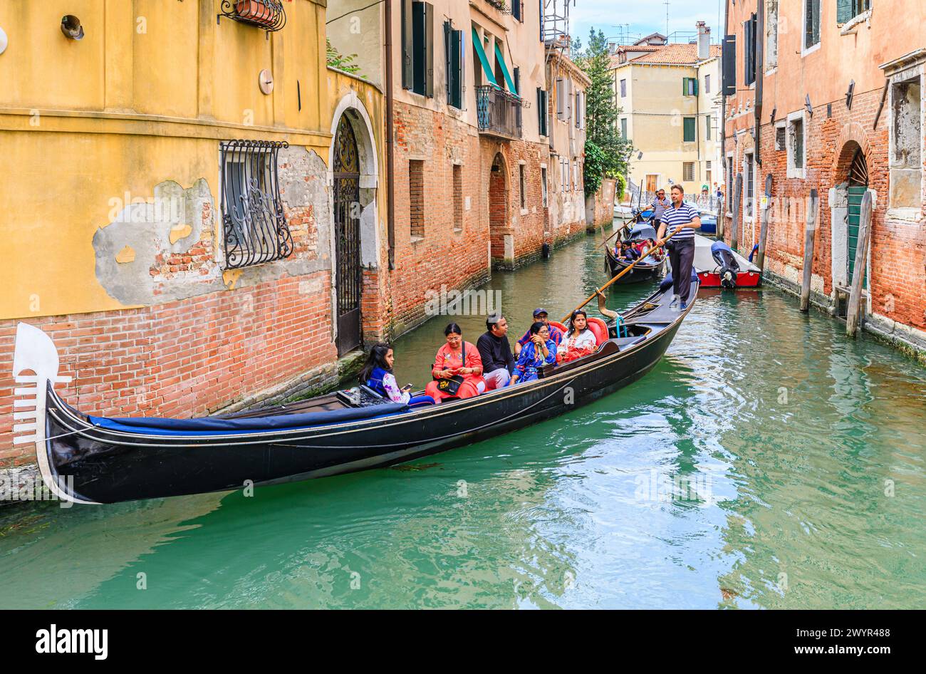 Traditional tourist boat trips: gondola boat rides on typical gondolas ...