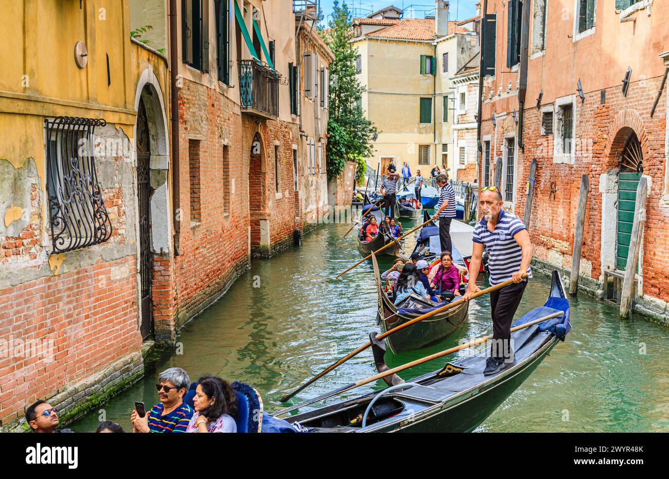 Traditional tourist boat trips: gondola boat rides on typical gondolas ...