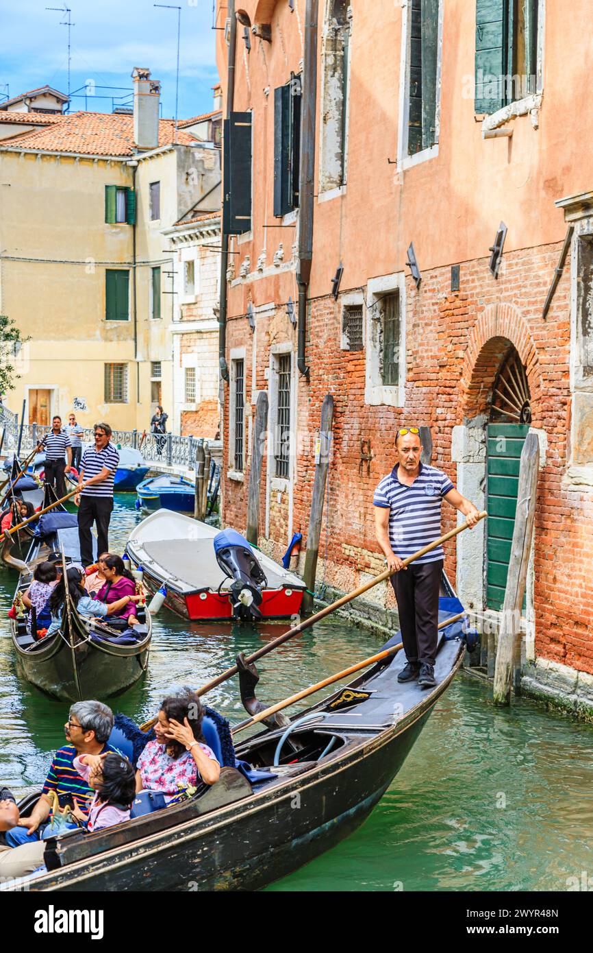 Traditional tourist boat trips: gondola boat rides on typical gondolas ...