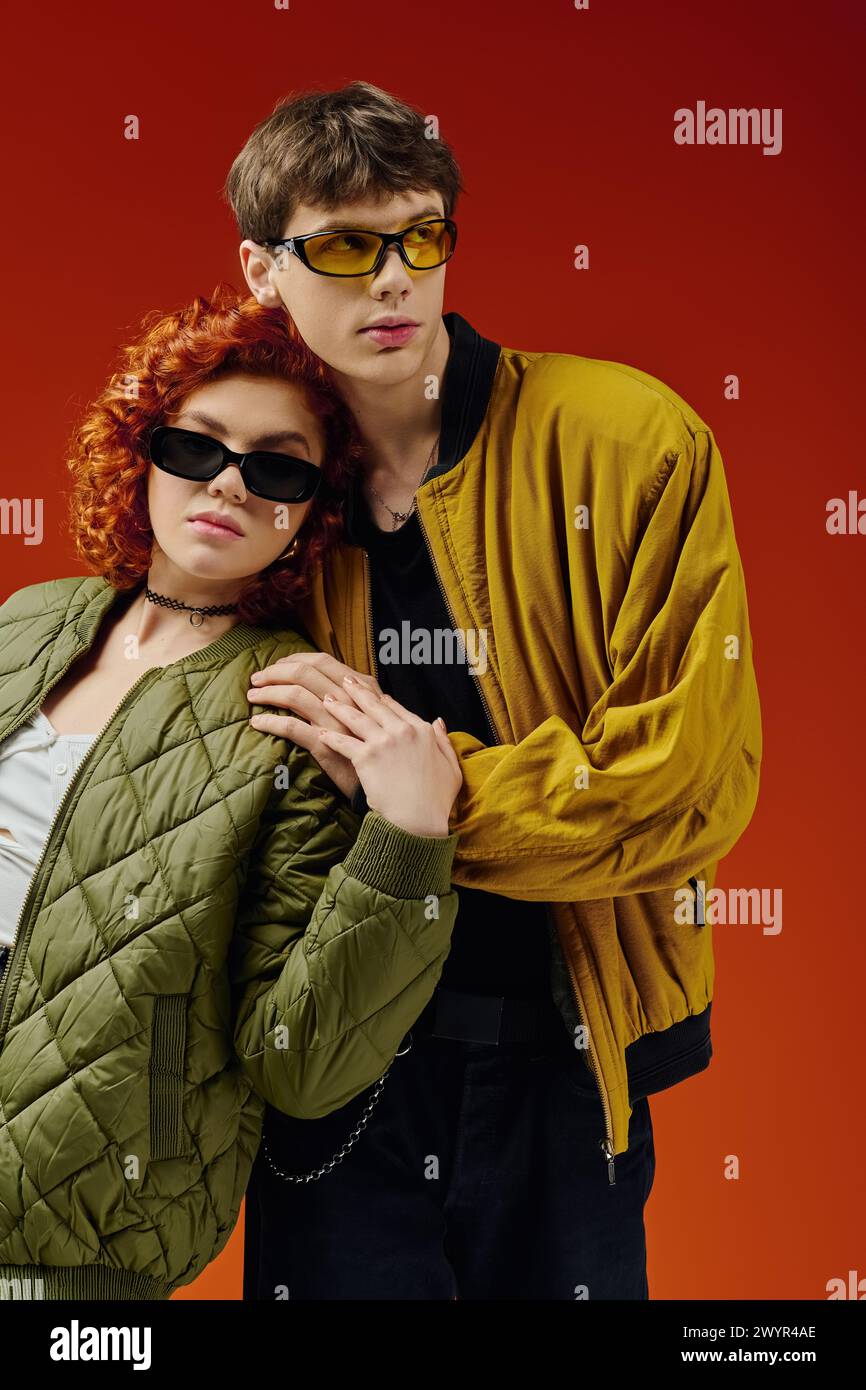 good looking loving couple in fashionable attires with sunglasses ...
