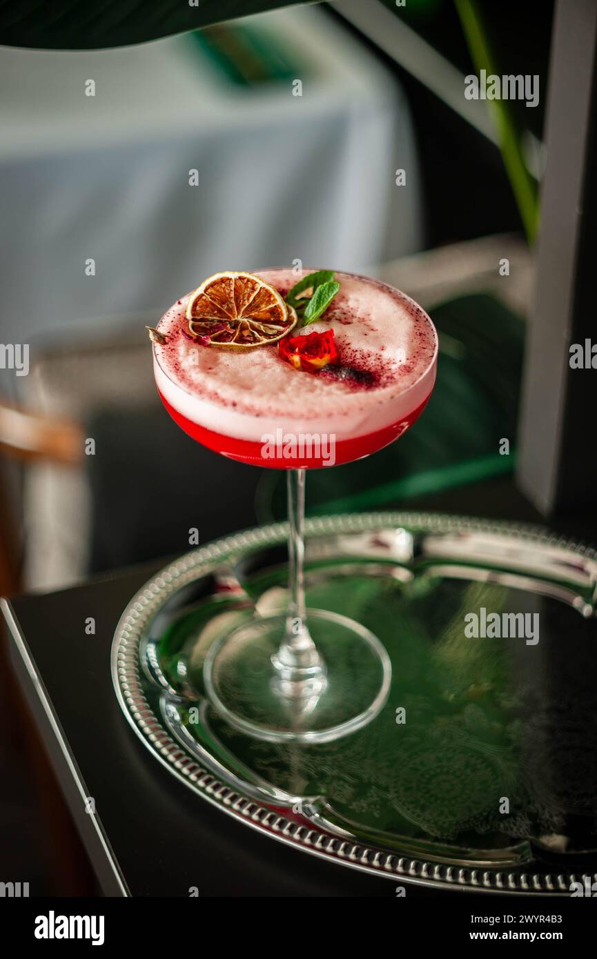 Pink lady alcoholic cocktail drink with gin, grenadine syrup and lemon ...