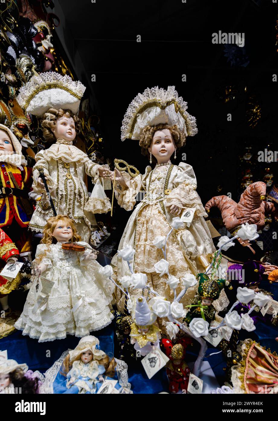 Traditionally lace dressed dolls on display in a shop for sale as ...