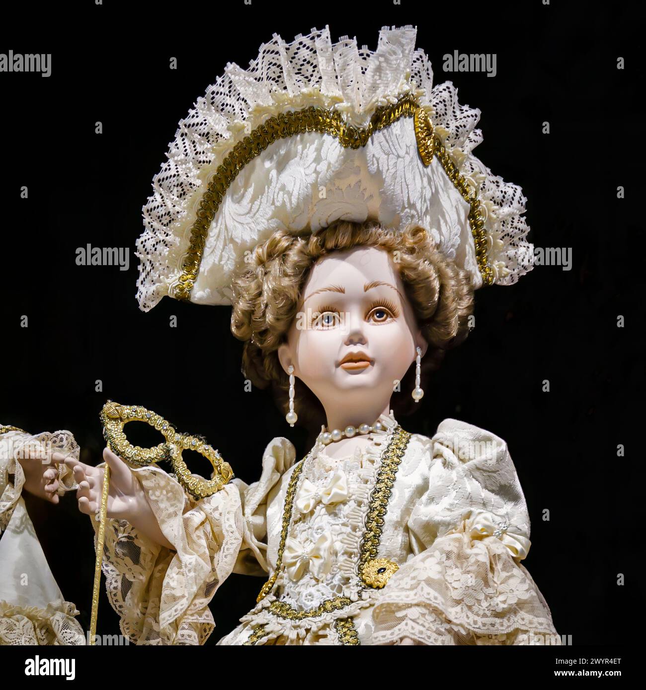 Head of a traditionally lace dressed doll on display in a shop for sale ...