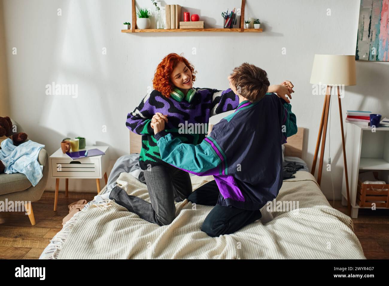 appealing cheerful boyfriend and girlfriend in vivid attires having ...