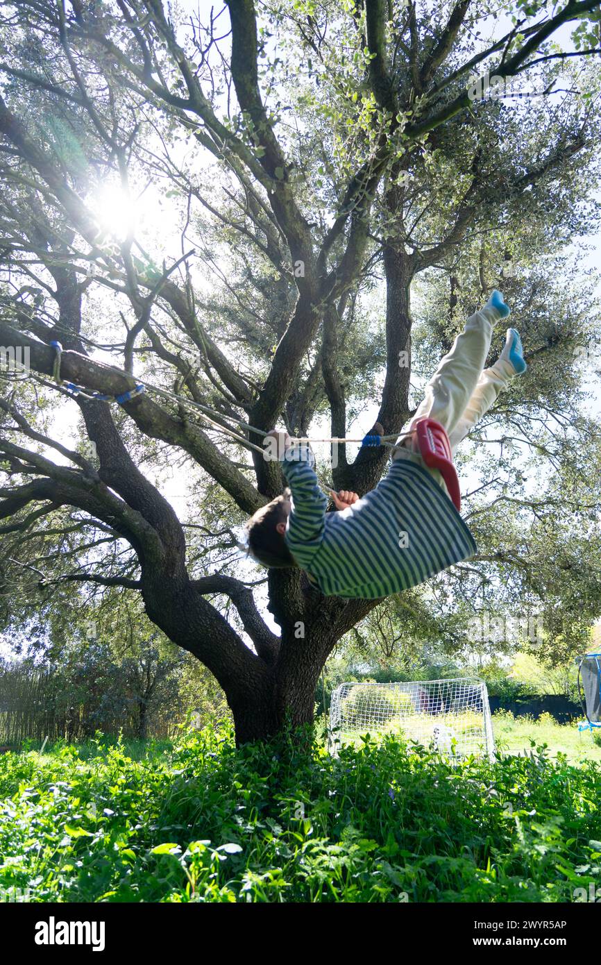 Swinging from a tree hi-res stock photography and images - Alamy