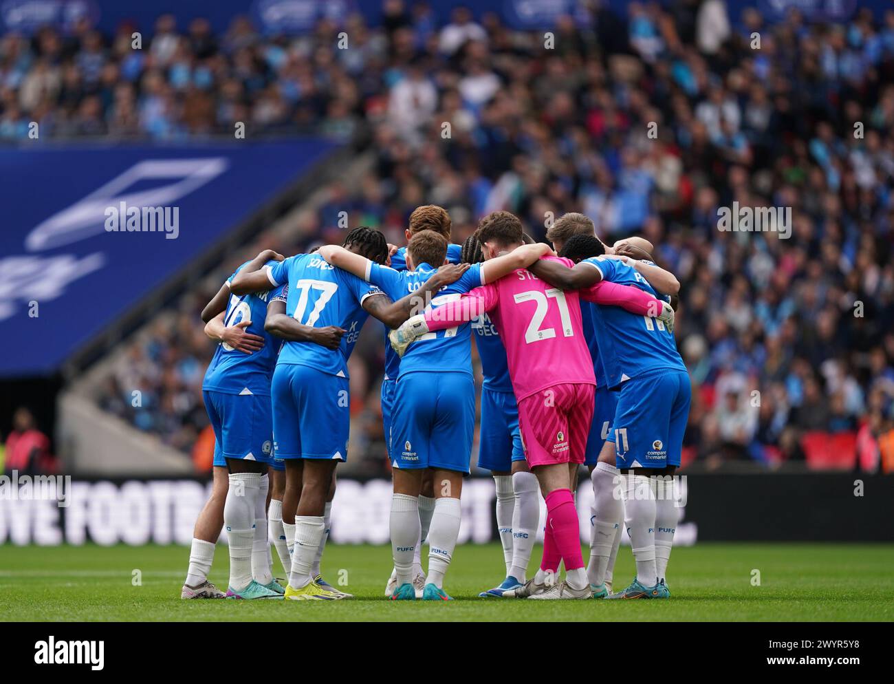 LONDON, ENGLAND - APRIL 7: The Peterborough United team huddle before ...