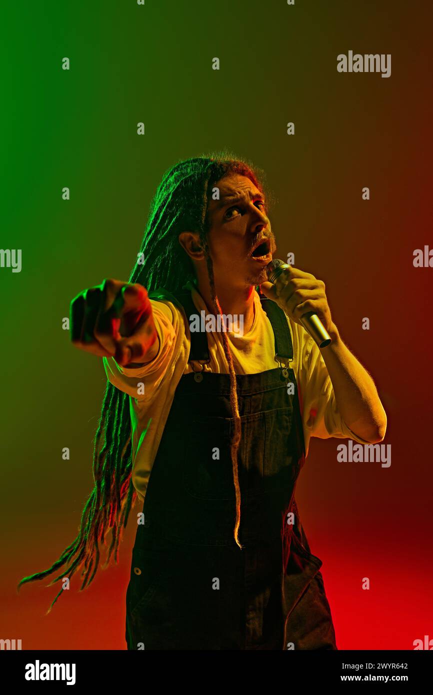 Emotional atmosphere created by man with dreadlocks showing ...