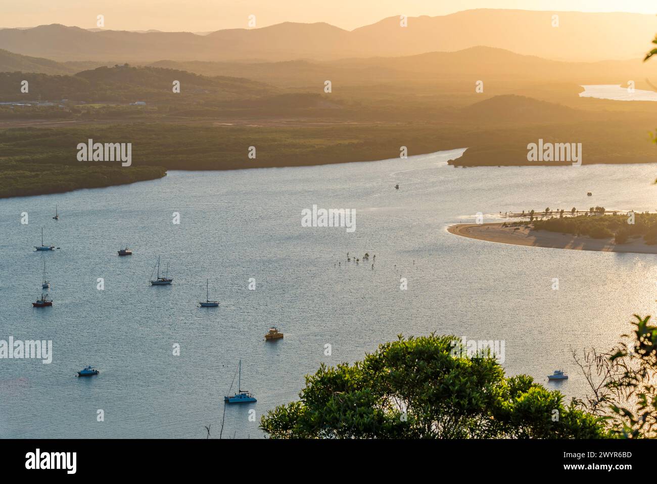 A sunset view of boats anchored in the Endeavour River from Grassy Hill ...