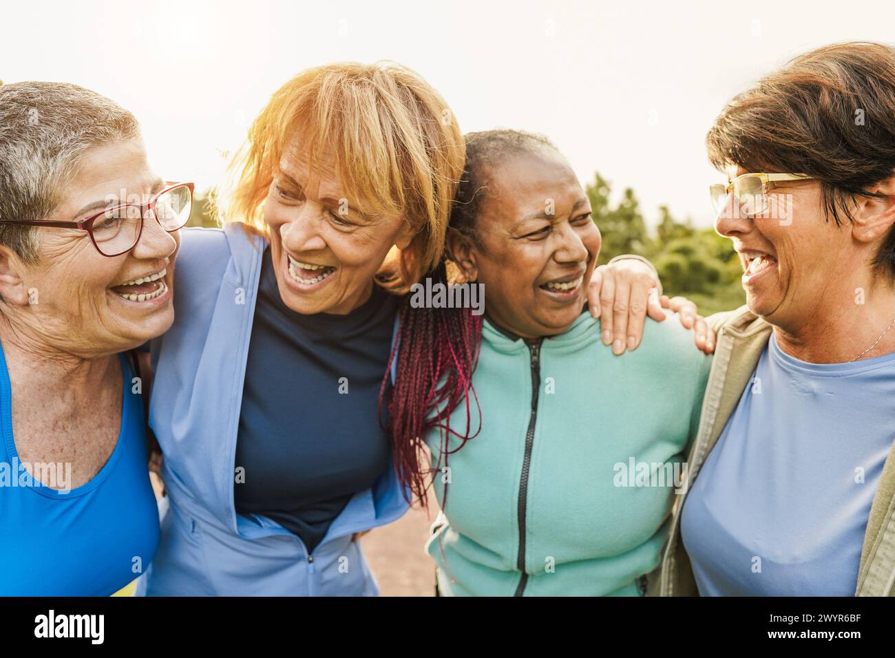 Happy senior women having fun after yoga session outdoor at city park ...