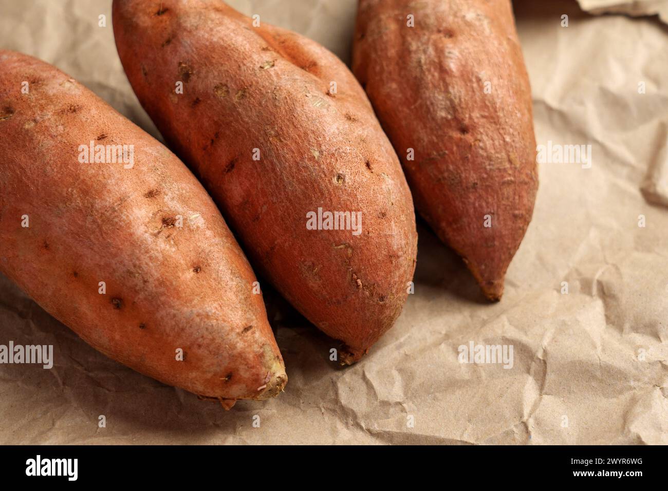 Raw sweet potato (yam) close up. Unpeeled whole batata root Stock Photo ...
