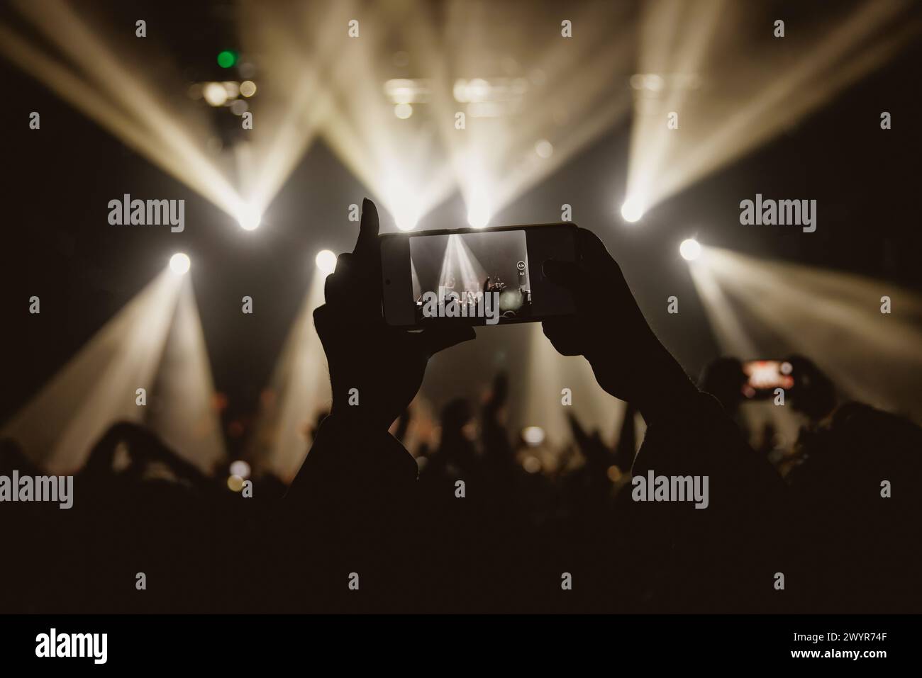 A mesmerizing moment unfolds at a live concert, recorded via mobile ...