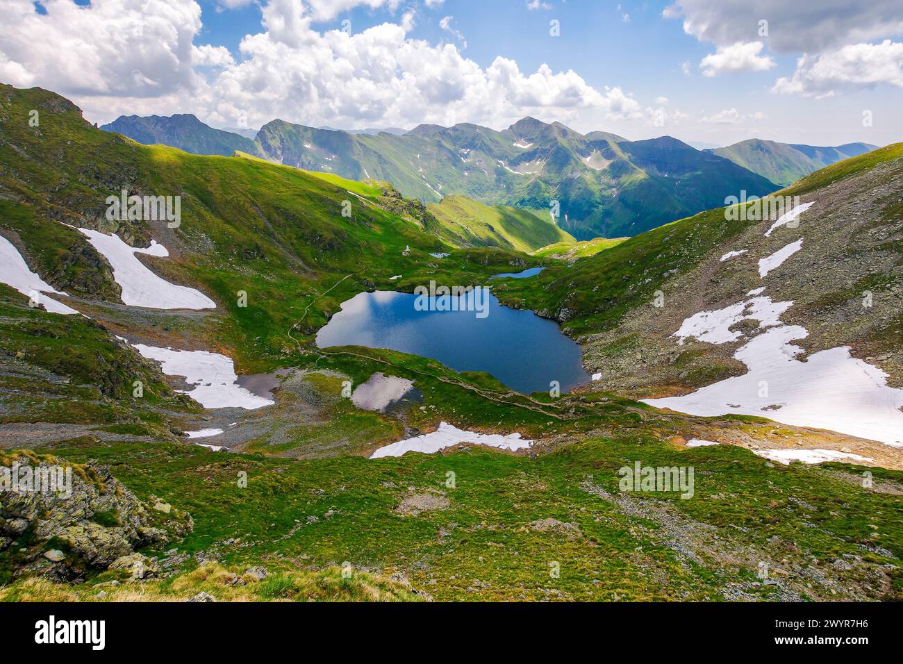 alpine landscape of fagaras mountains. capra lake of romania in summer ...