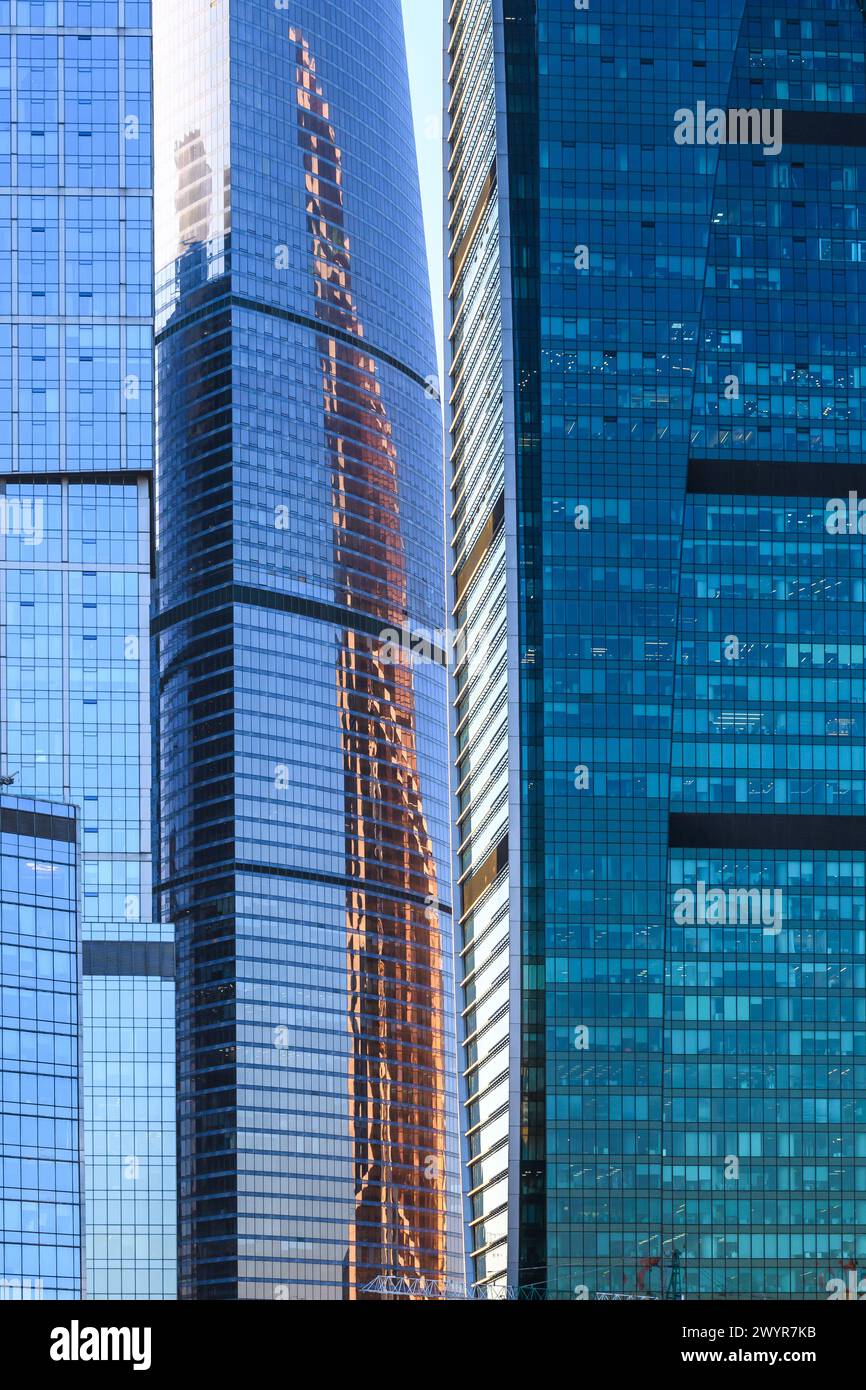 Buildings of modern architecture reflect each other in mirror walls ...
