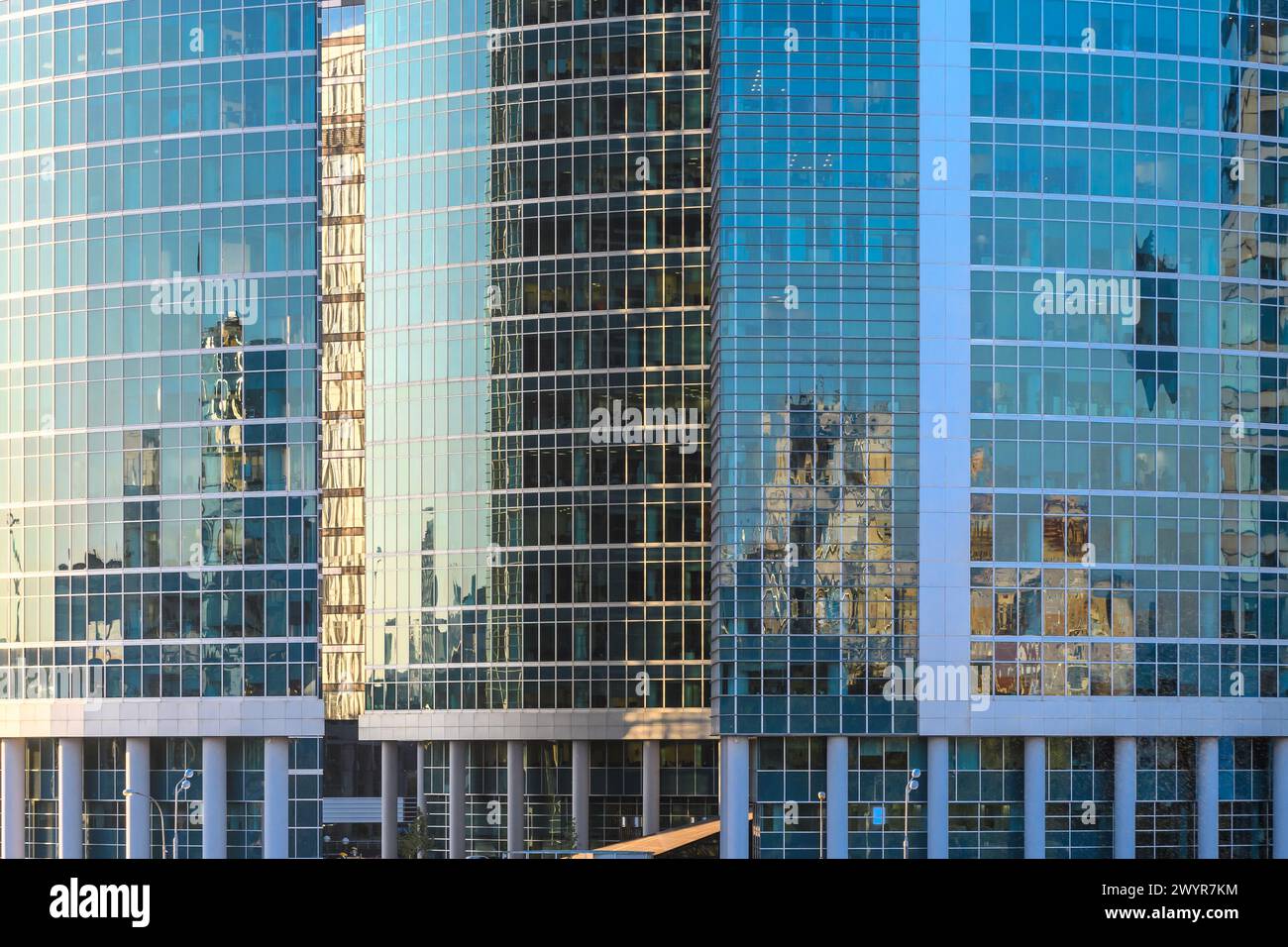 Buildings of modern architecture reflect each other in mirror walls ...