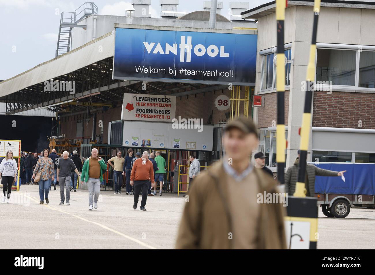 Workers pictured outside the Van Hool bus assembly plant in ...