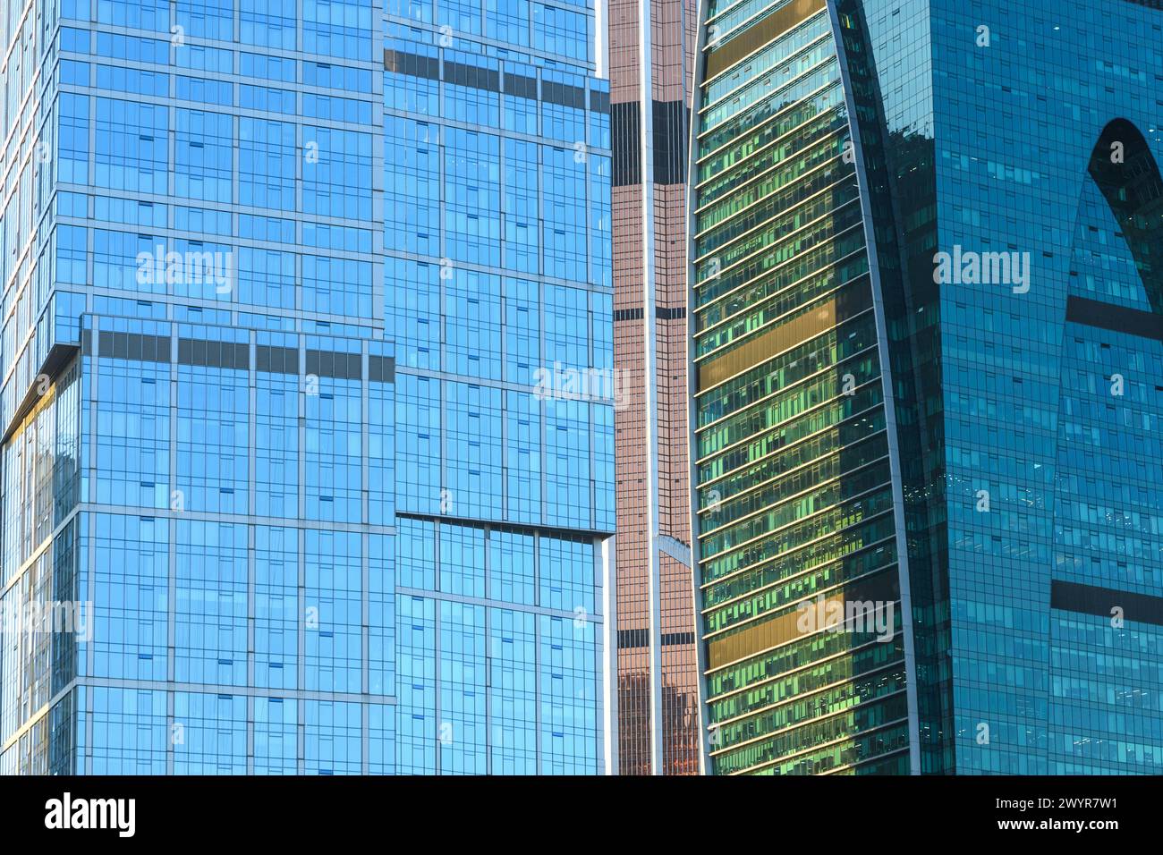 Buildings of modern architecture reflect each other in mirror walls ...