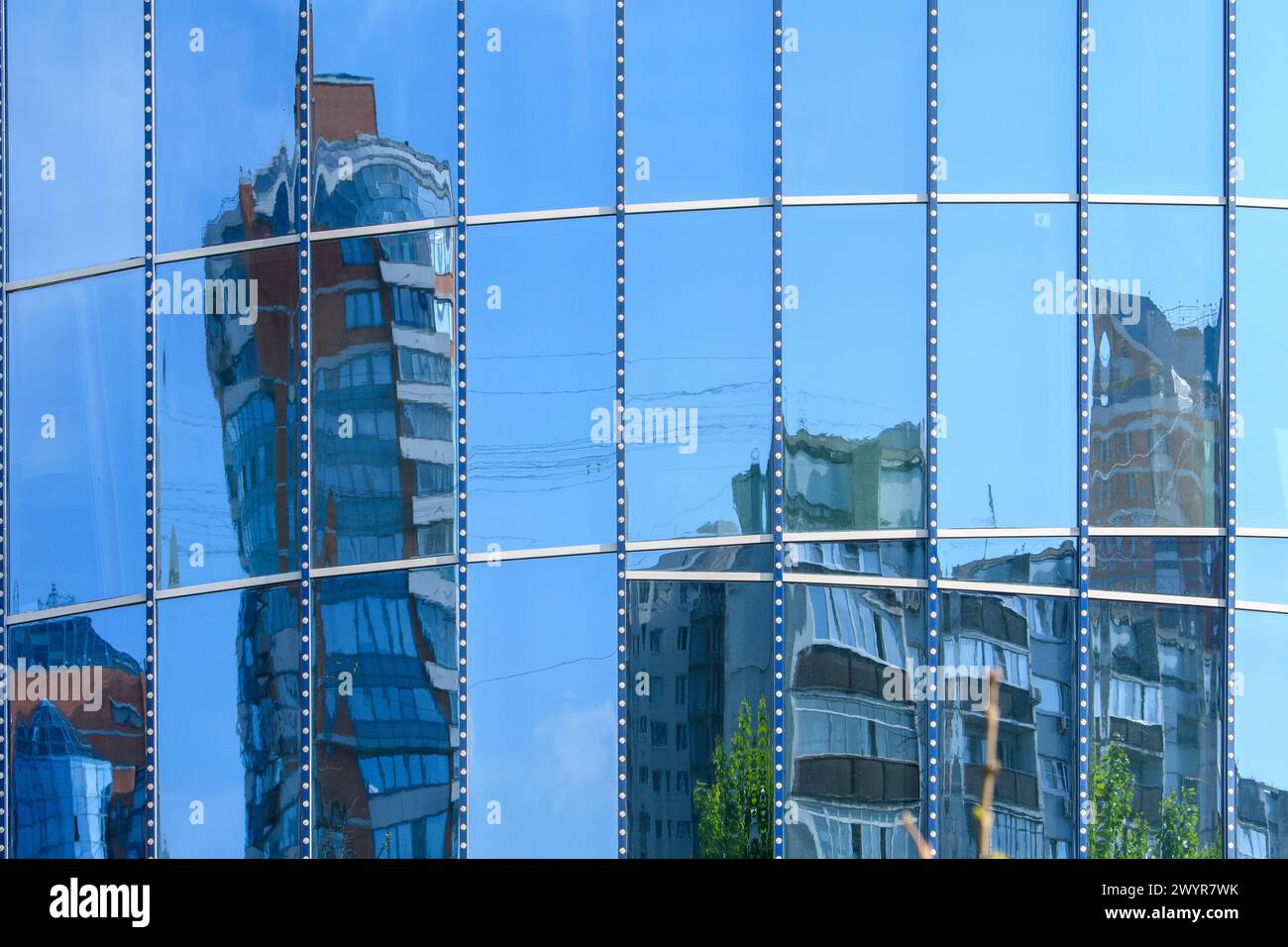 Buildings of modern architecture reflect each other in mirror walls ...