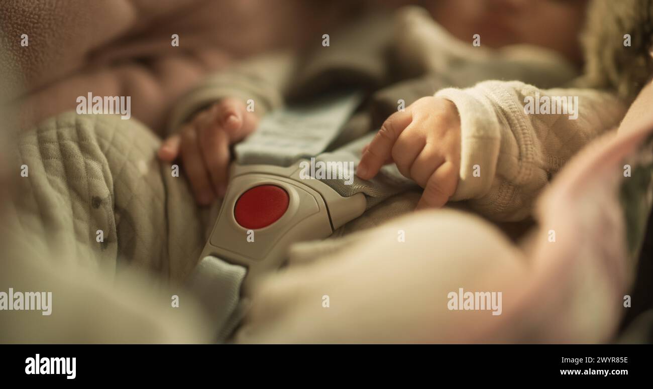 Shot of a Cute Asian Baby Sitting Calmly in a Car Seat with Safety Belt ...