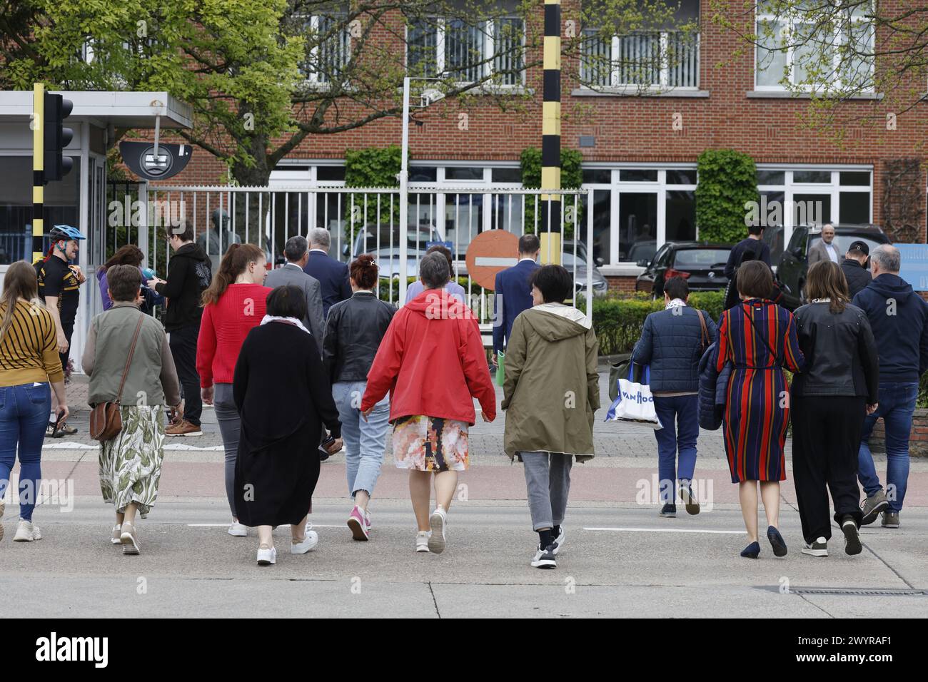 Workers pictured outside the Van Hool bus assembly plant in ...