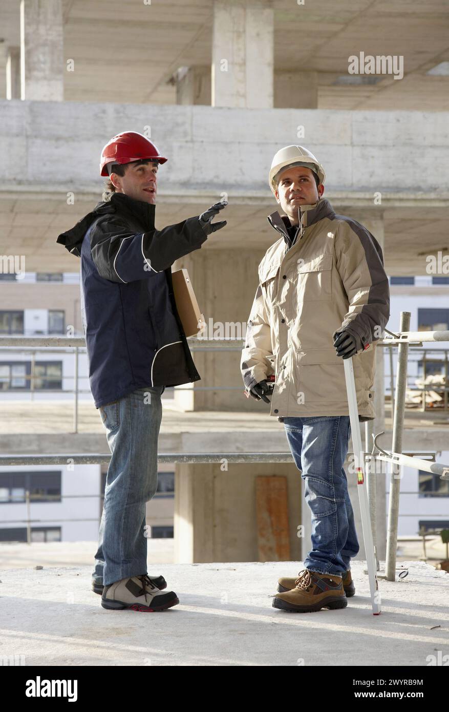 Architect and construction worker, personal protective equipment ...