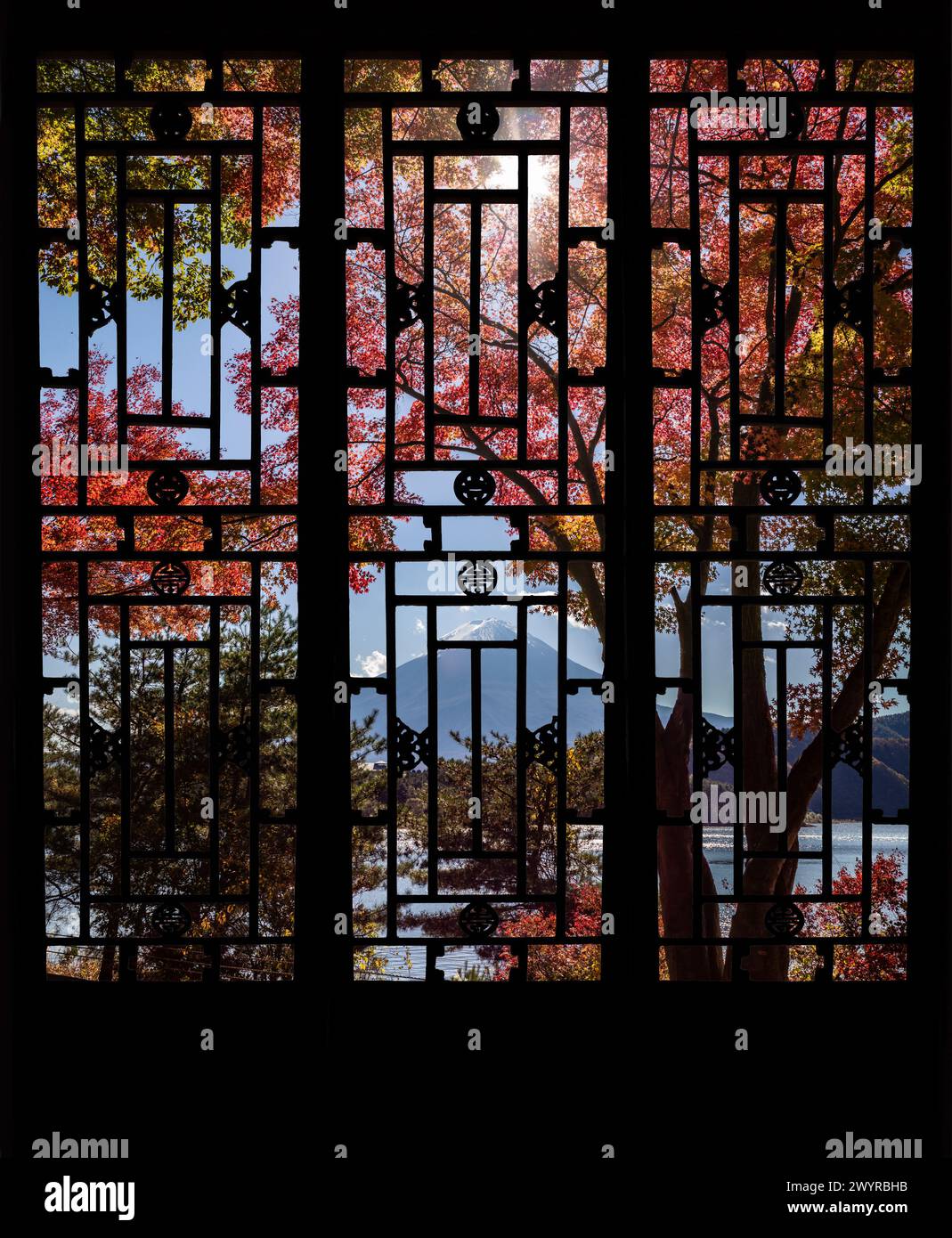 View through a fretwork screen panel of an autumnal Mount Fuji, Japan ...