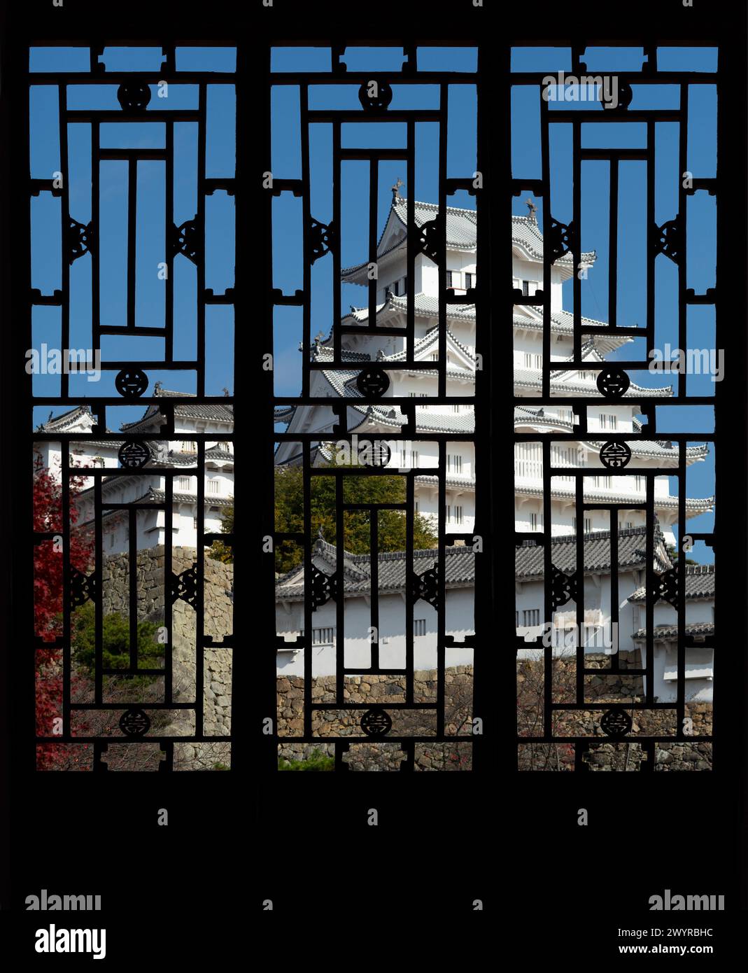 View through a fretwork screen panel of Himeji Castle, Japan Stock ...