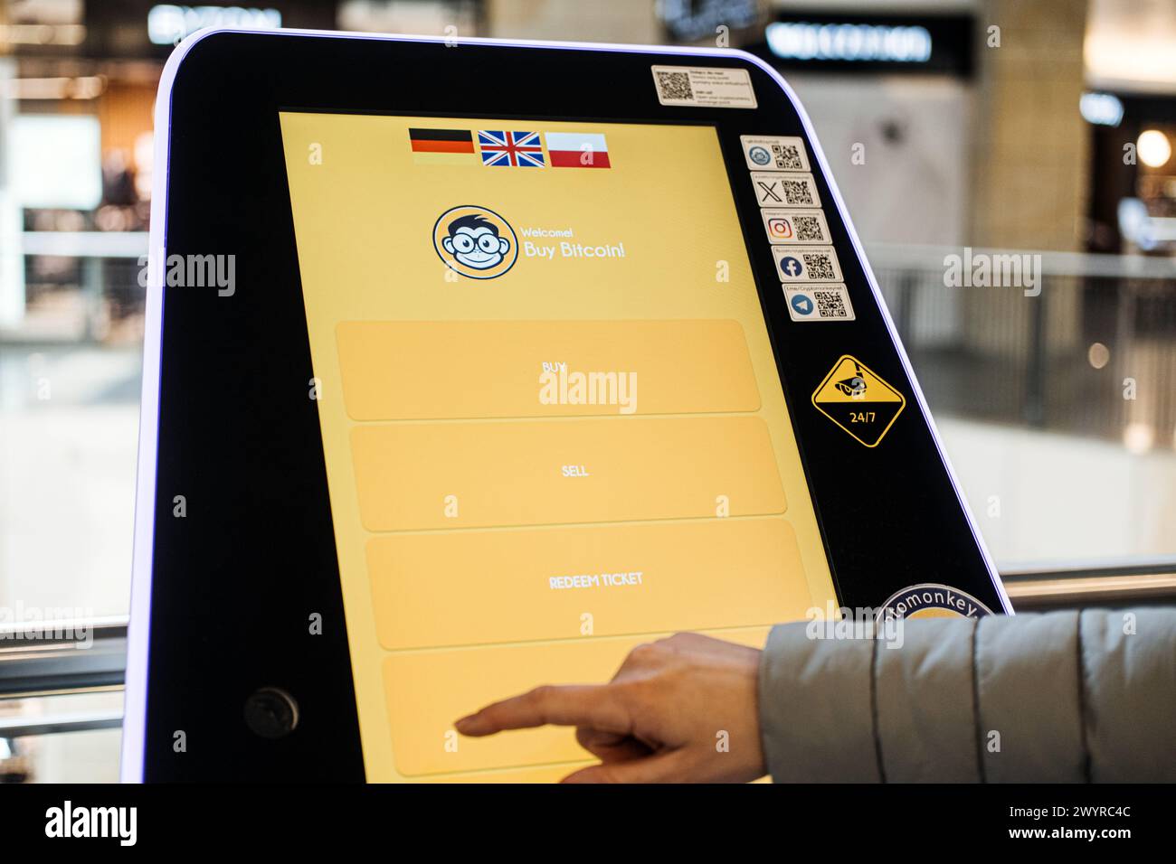 Warsaw, Poland - March 19, 2024. Person Using Bitcoin ATM for ...