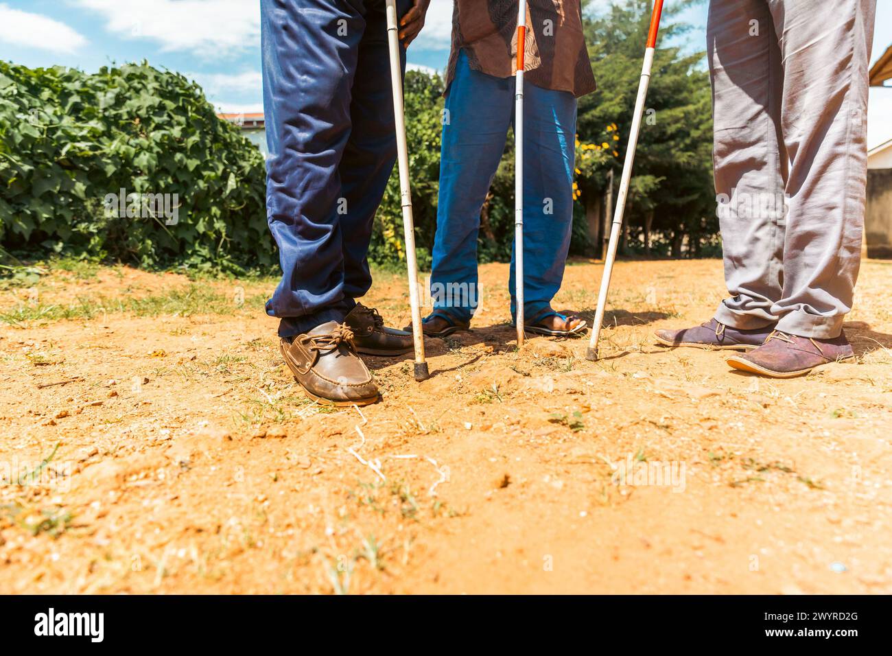 Close up of the feet of three blind people using the cane to walk Stock ...