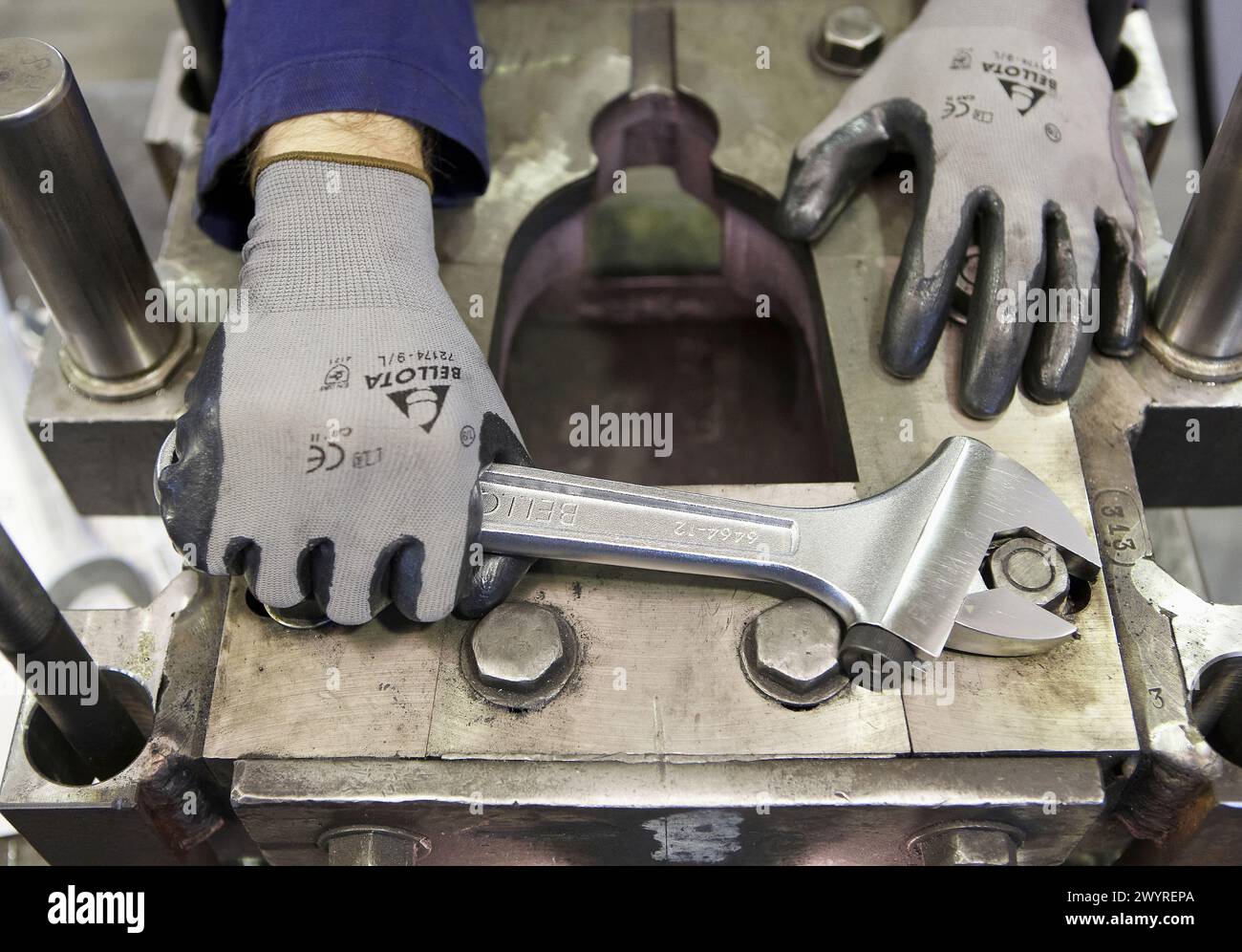 Fitting forging mold with adjustable wrench, metallurgy Stock Photo - Alamy