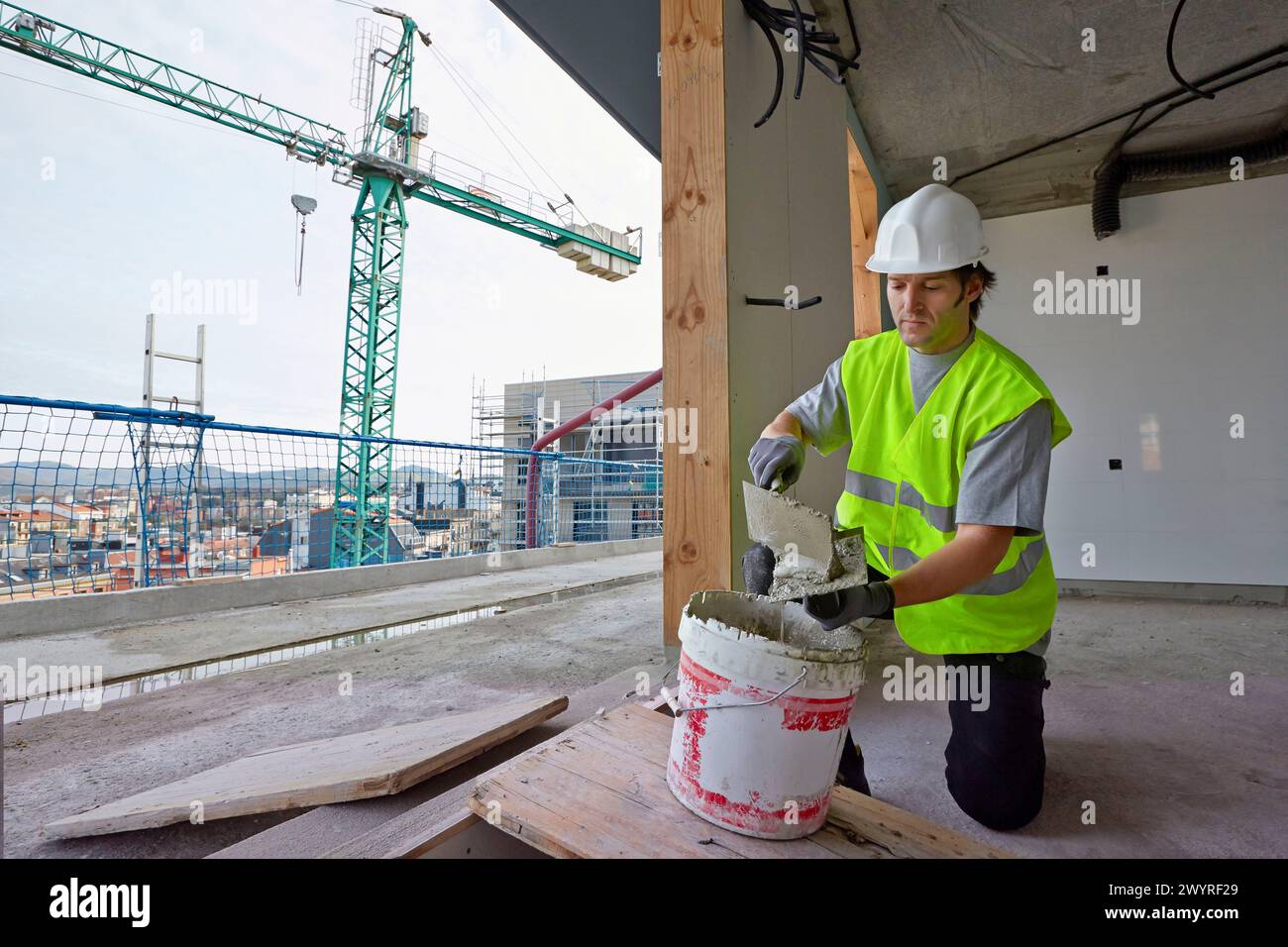 Mason with trowel, Bricklayer with personal protective equipment, PPE ...