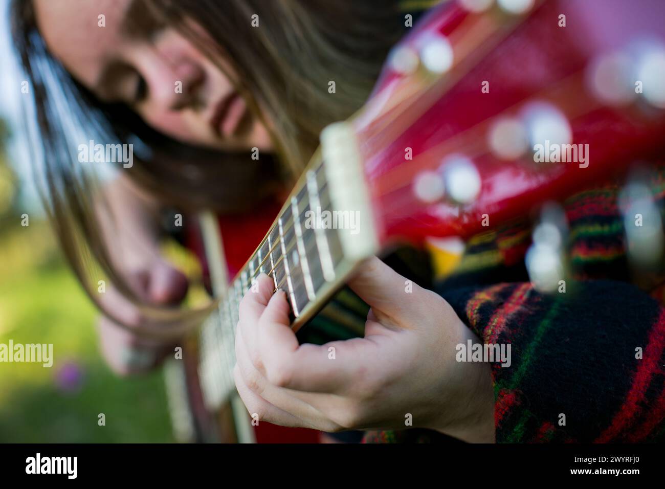 Strumming the guitar hi-res stock photography and images - Alamy