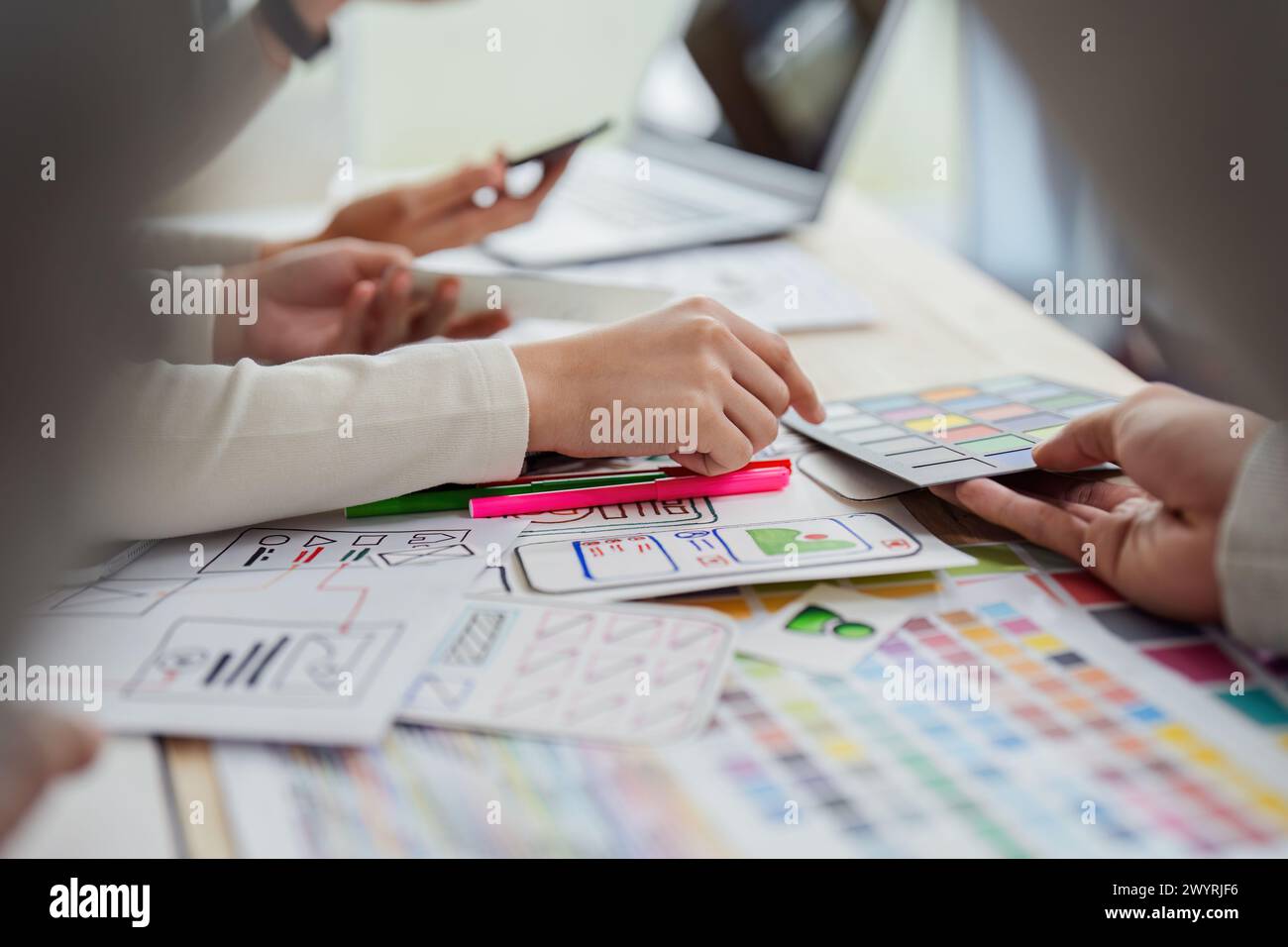 UI designer and UX developer brainstorm idea to design the application ...