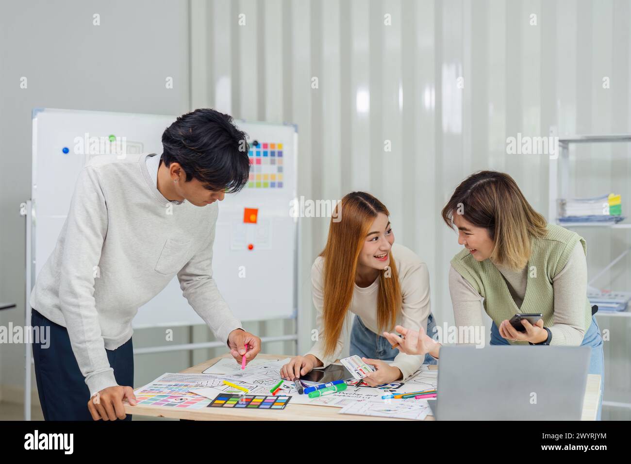 UI designer and UX developer brainstorm idea to design the application interface. Creative ...