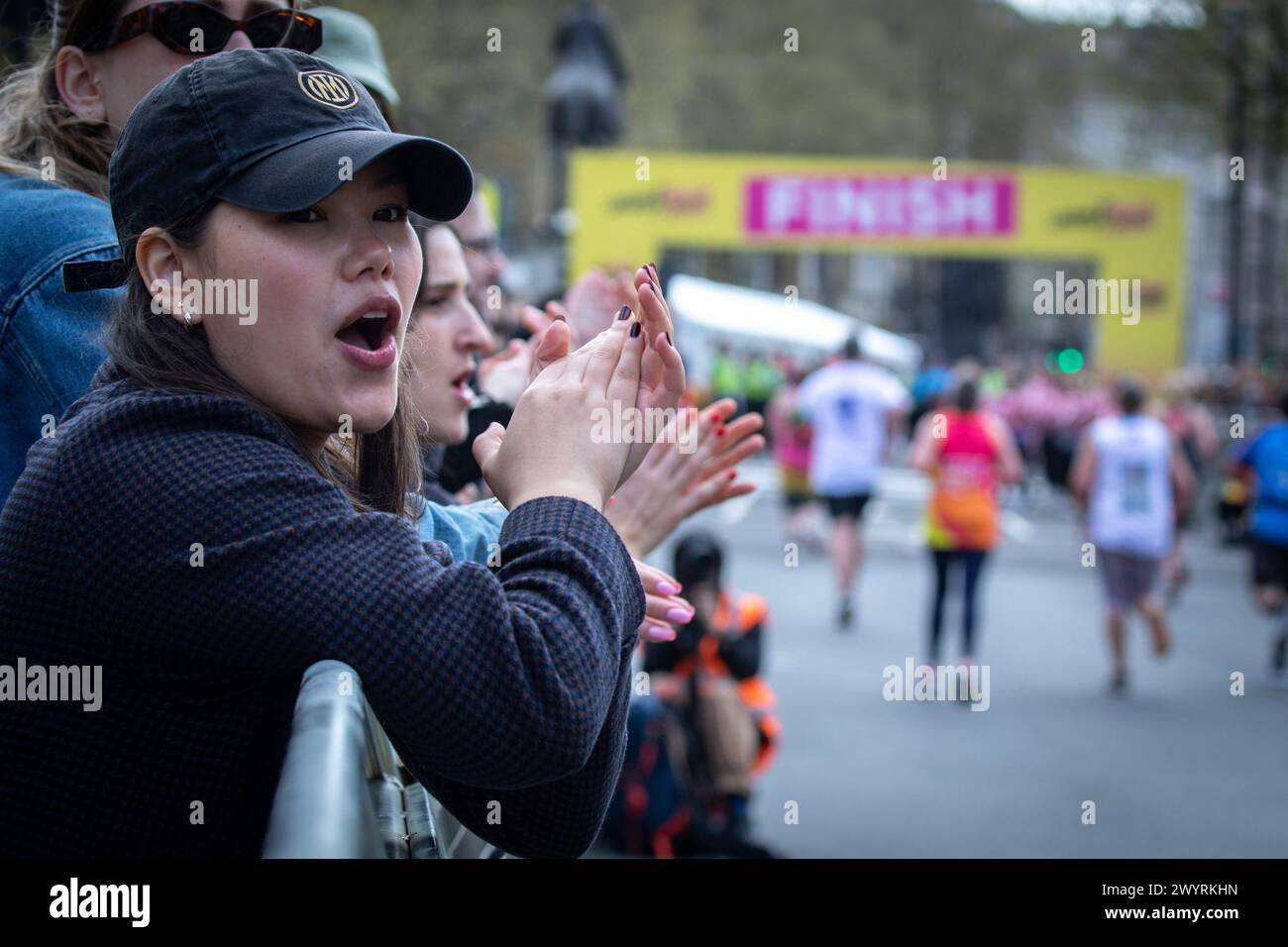 London, UK. 07th Apr, 2024. A spectator cheers near the finishing line ...