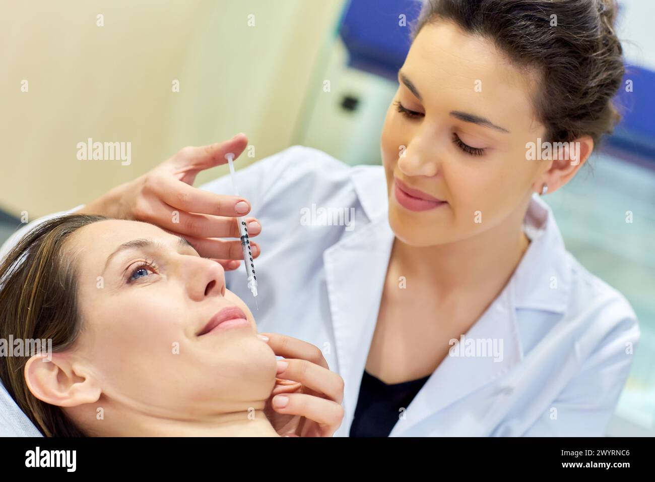 Syringe. Botox, cosmetic medicine. Botulinum toxin treatment involves ...