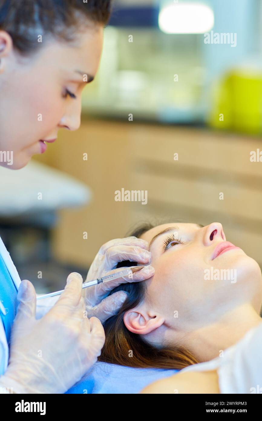 Syringe. Botox, cosmetic medicine. Botulinum toxin treatment involves ...